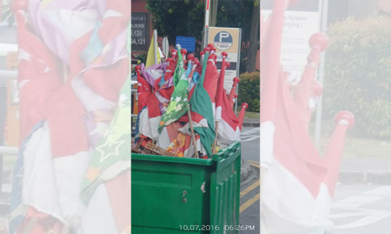 National flags hitch a ride in dumpster at Jalan Bukit Merah ...