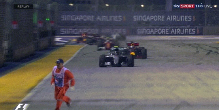 Race marshall almost run over by F1 cars at S'pore Grand Prix ...