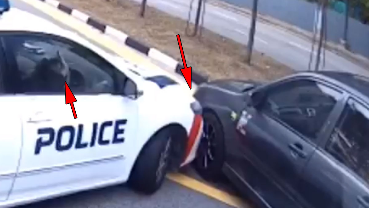 S'pore police car in yellow box almost hits car, both reverse & drive ...