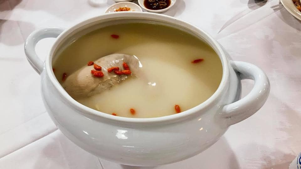 Serangoon zi char stall sells soup with whole black chicken inside pig ...