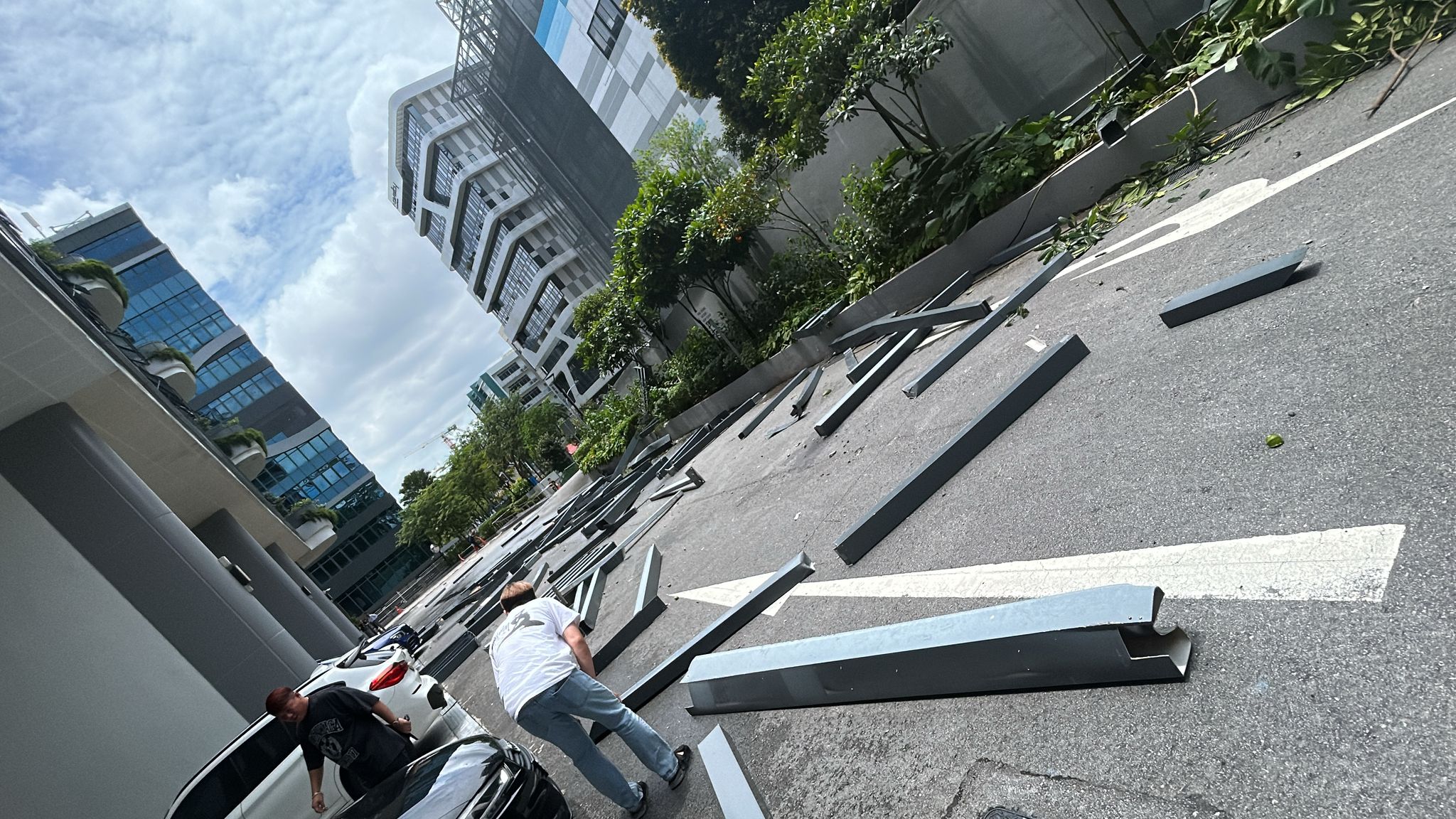 Metal beams fall from 8-storey Bartley building, almost hits man taking ...