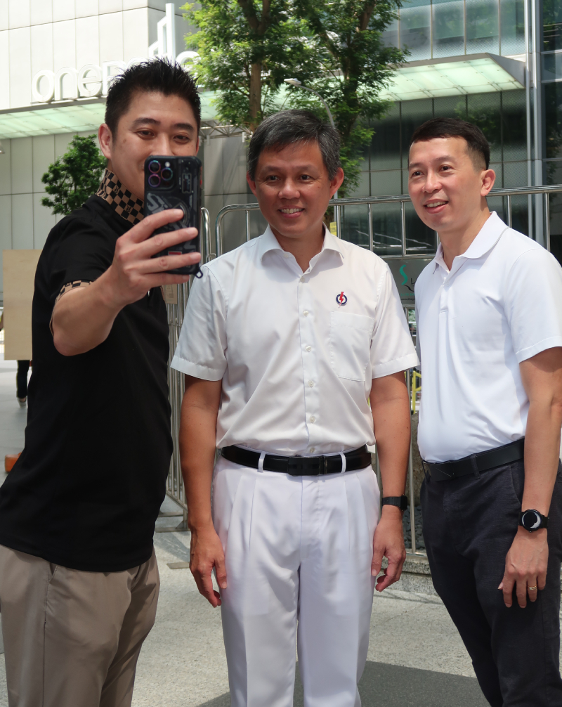 Office workers, as well as GE2025 opposition candidate, attend PAP ...