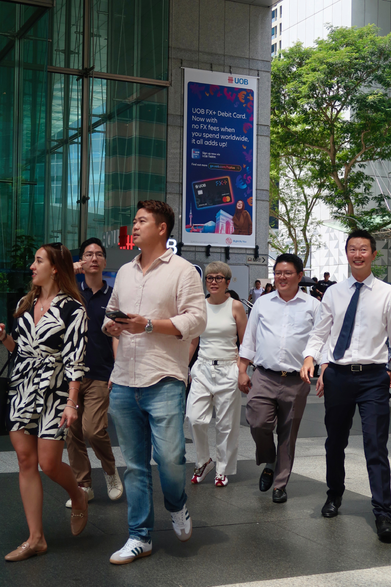 Office workers, as well as GE2025 opposition candidate, attend PAP ...