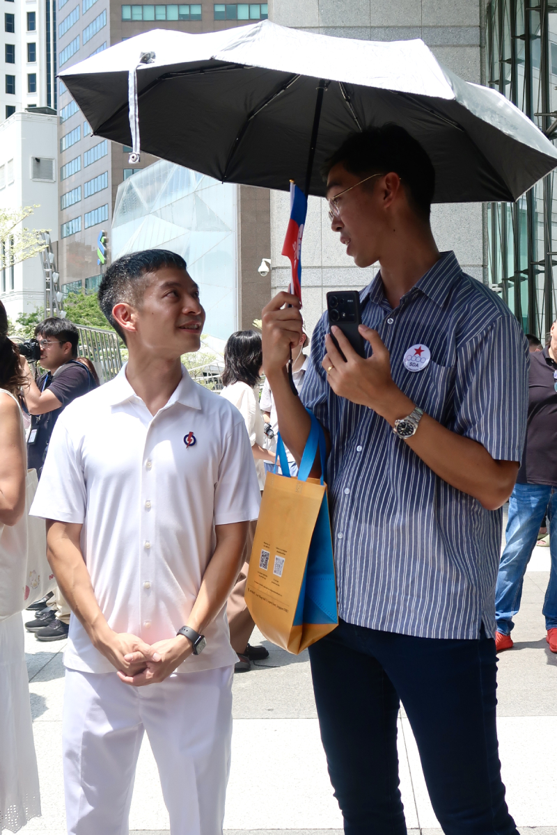Office workers, as well as GE2025 opposition candidate, attend PAP ...