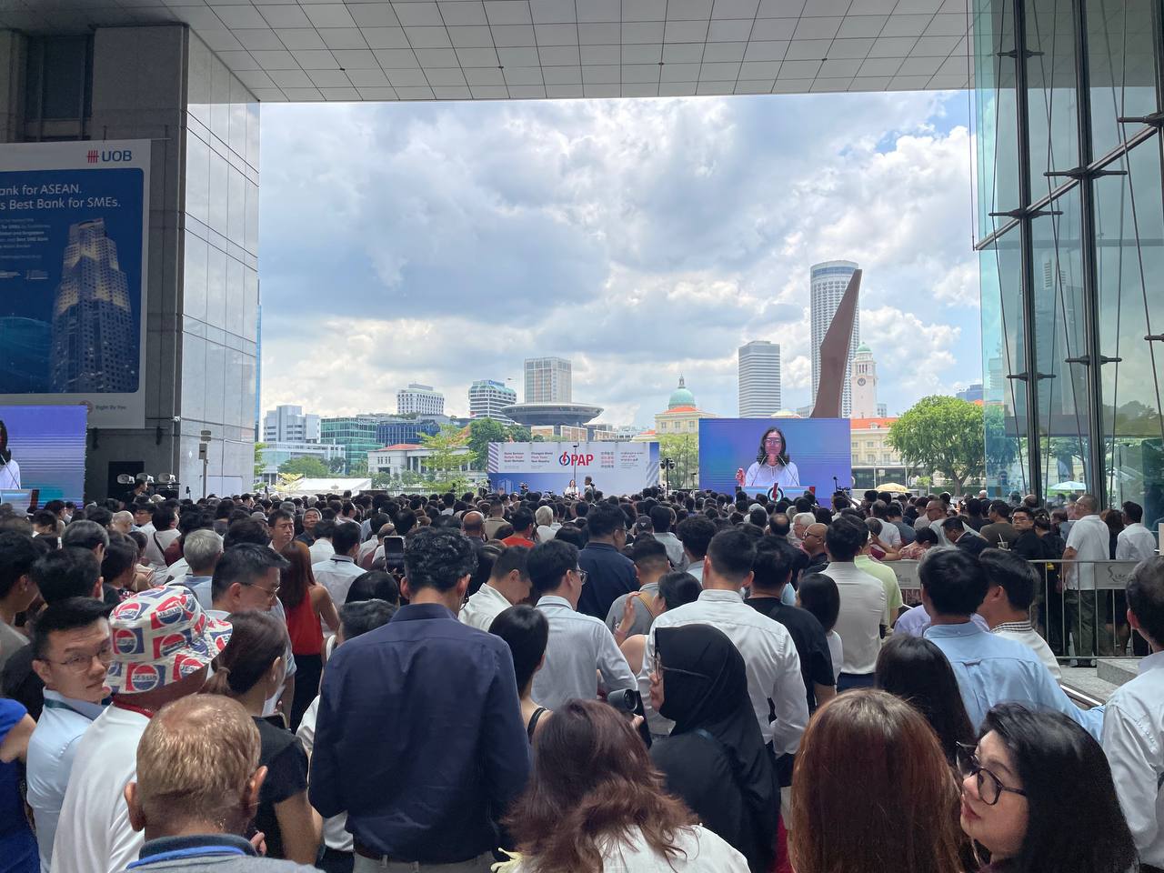 Office workers, as well as GE2025 opposition candidate, attend PAP ...