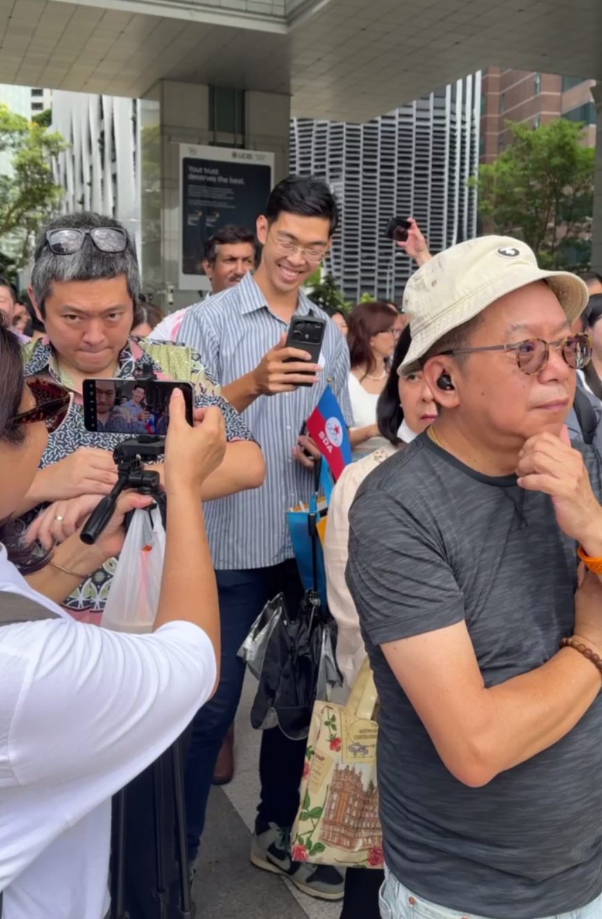 Office workers, as well as GE2025 opposition candidate, attend PAP ...