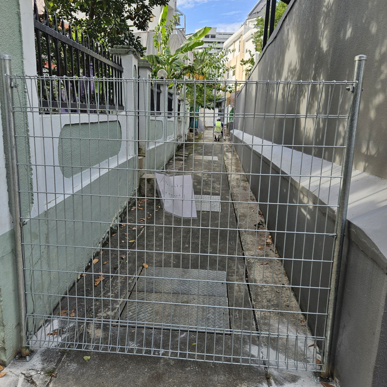 Back lane in Hougang used as shortcut for years suddenly fenced off ...