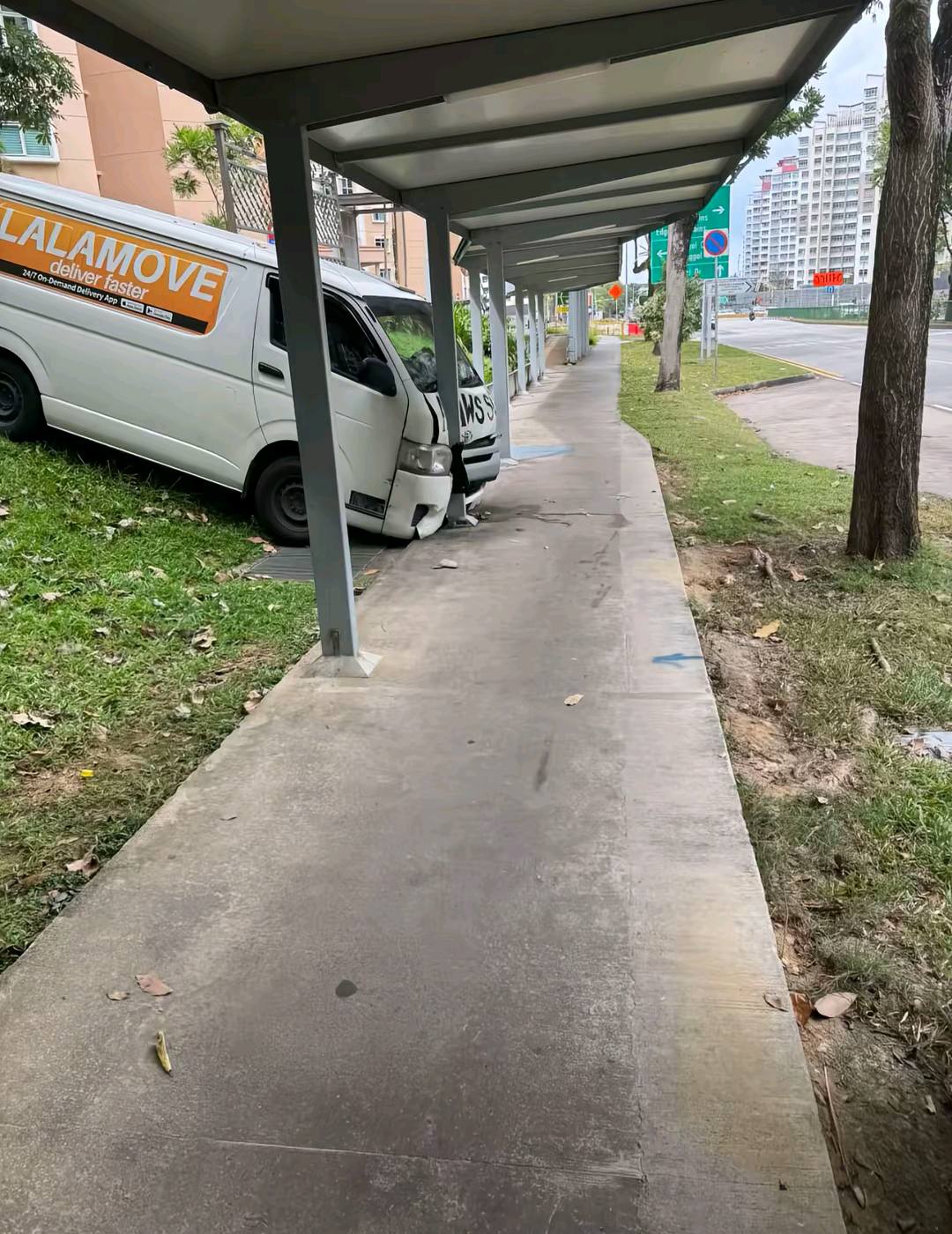 Van hits shelter pillar in Punggol, woman, 45, assisting with ...