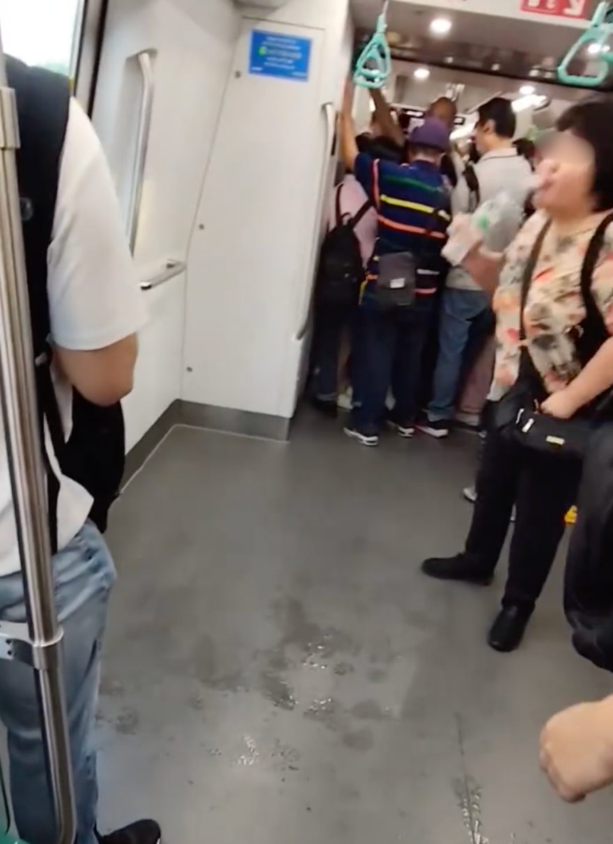 Woman filmed spitting water at passengers on North-South Line MRT train ...