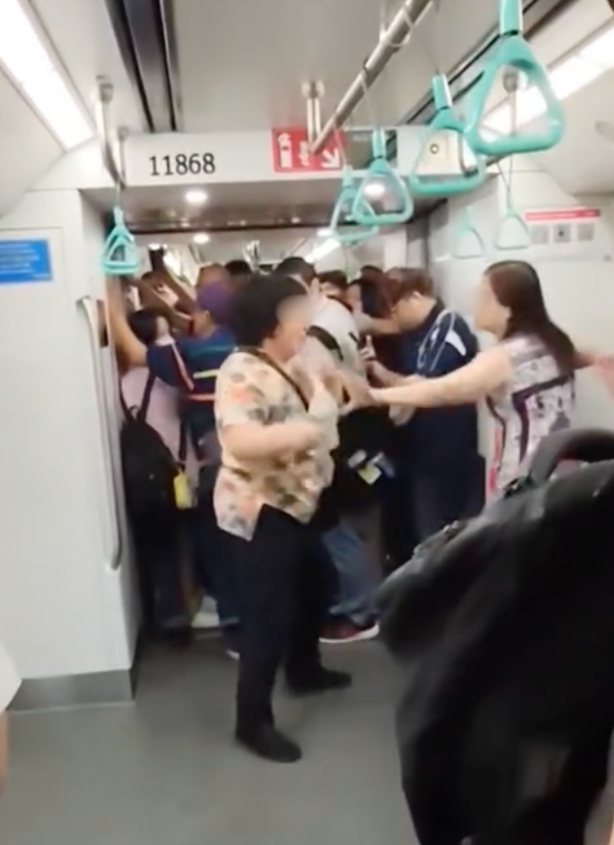 Woman filmed spitting water at passengers on North-South Line MRT train ...