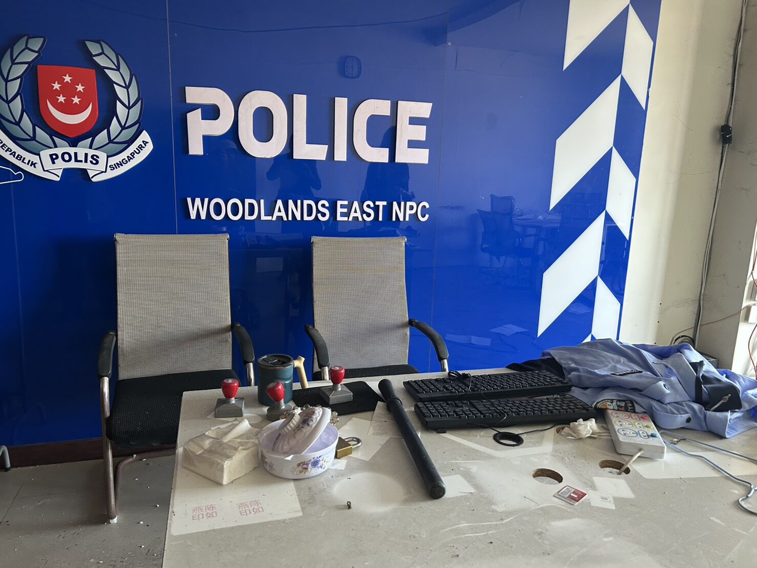Fake S'pore police office, uniforms, found in abandoned Cambodia scam ...