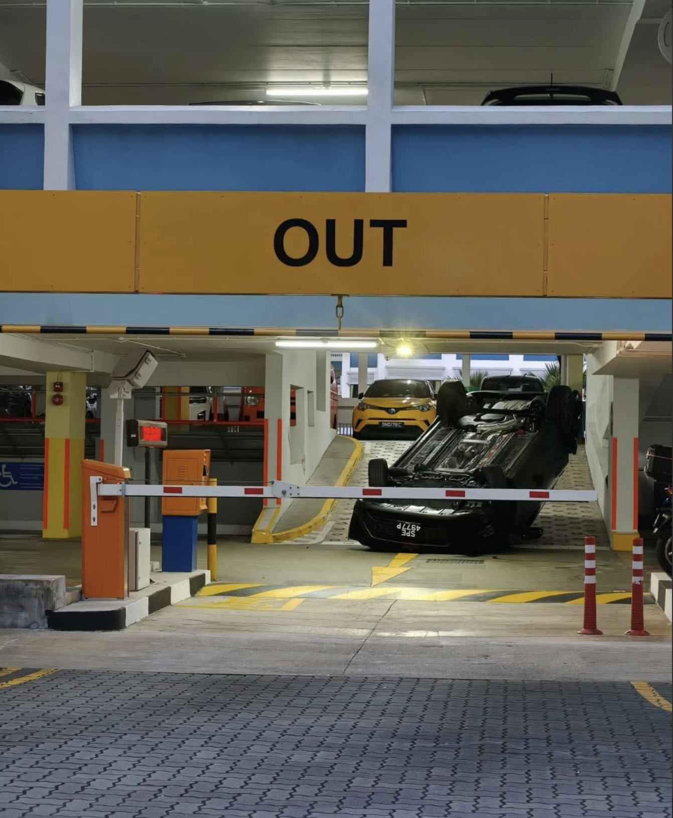 Car turns turtle at Woodlands carpark, driver, 41, assisting with ...